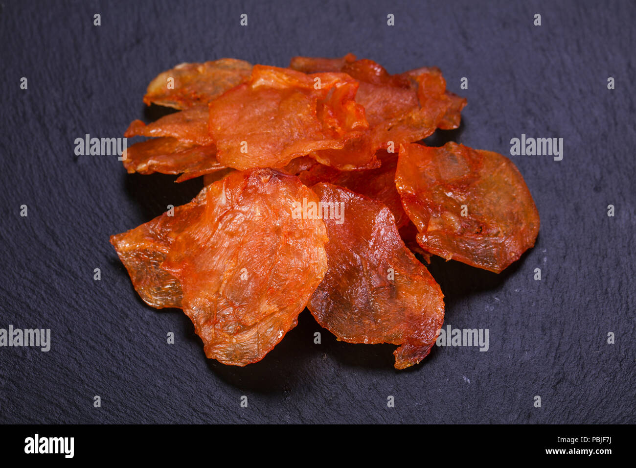 Dry chicken meat over wooden Stock Photo - Alamy