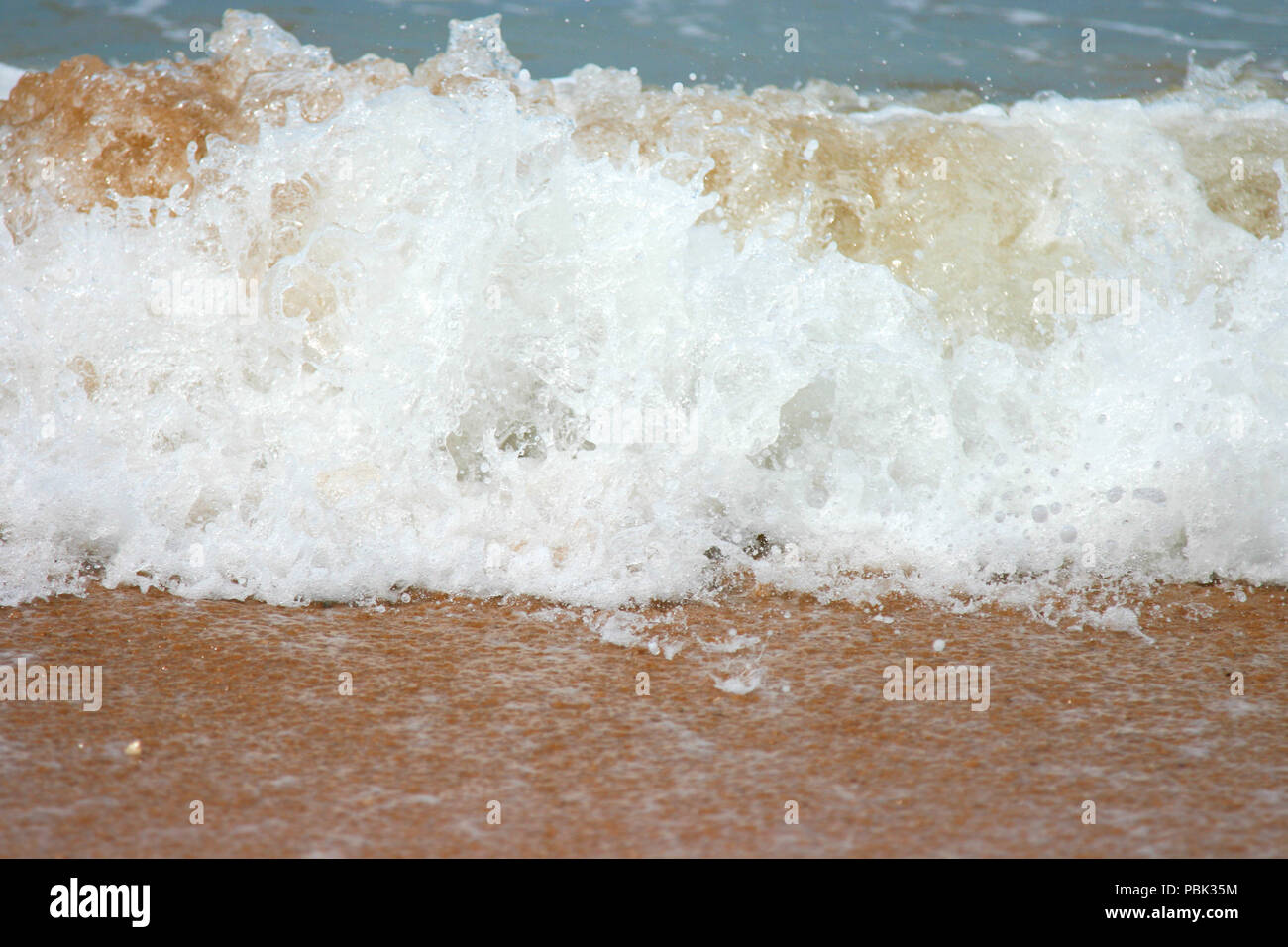 Sea wave on beach Stock Photo - Alamy
