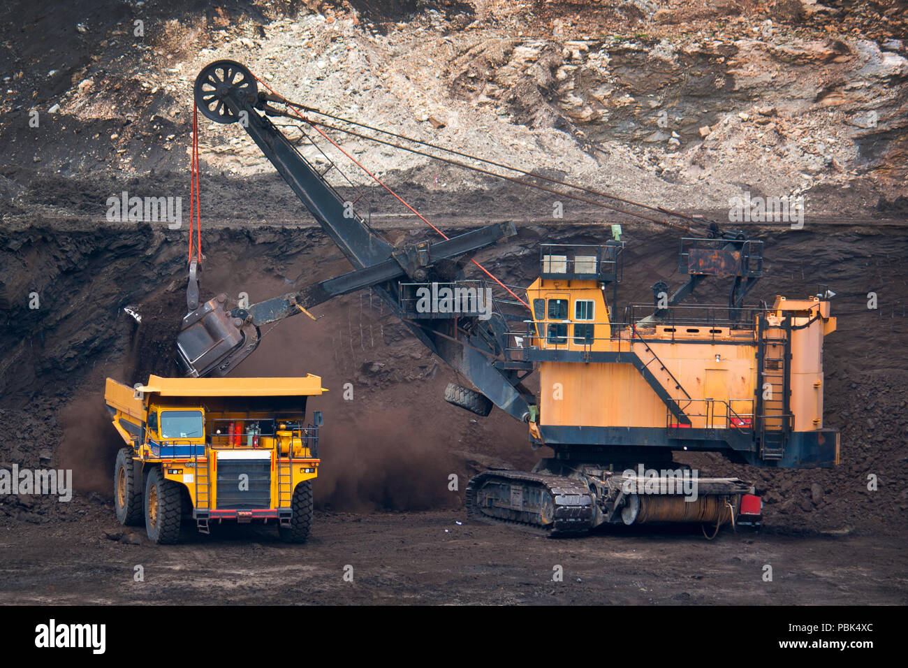 big mining truck unload coal Stock Photo - Alamy