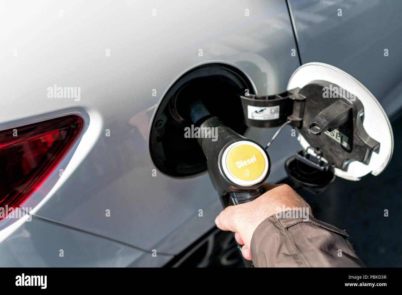 car refueling diesel pump at petrol station Stock Photo - Alamy