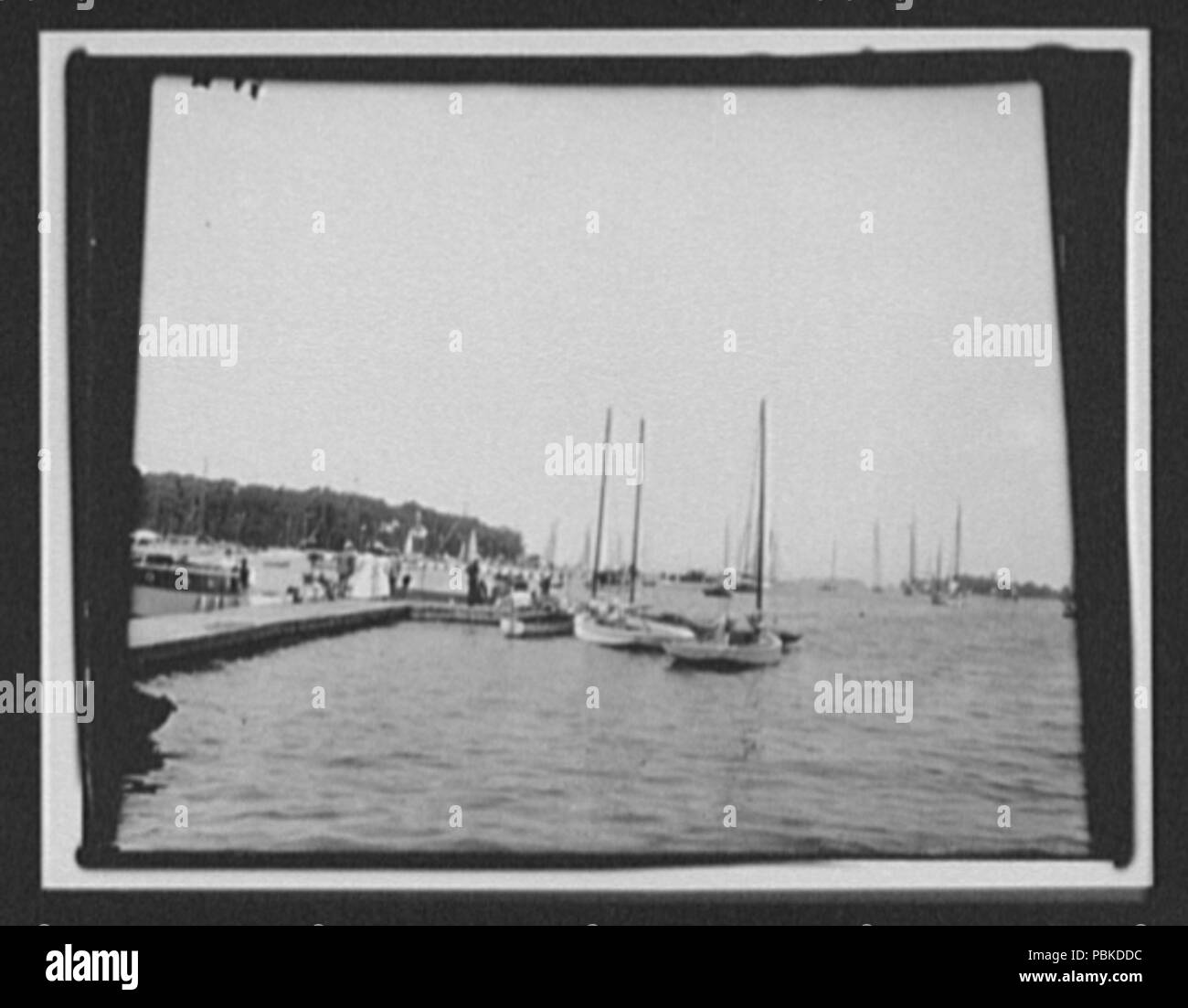Harbor scene; sailboats and other boats at dock Stock Photo - Alamy