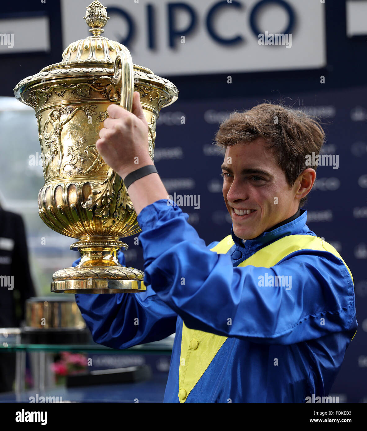 Jockey James Doyle poses with the trophy after winning the King George ...