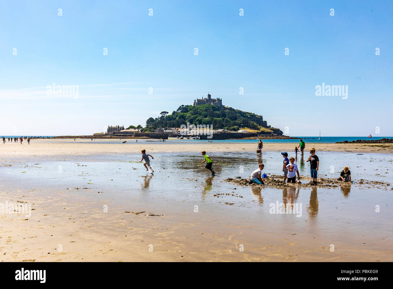 Children play on the beach at Marazion, Cornwall Stock Photo - Alamy
