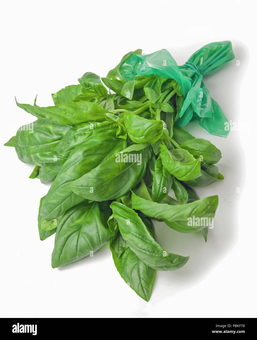 Bunch of fresh basil isolated on white Stock Photo - Alamy