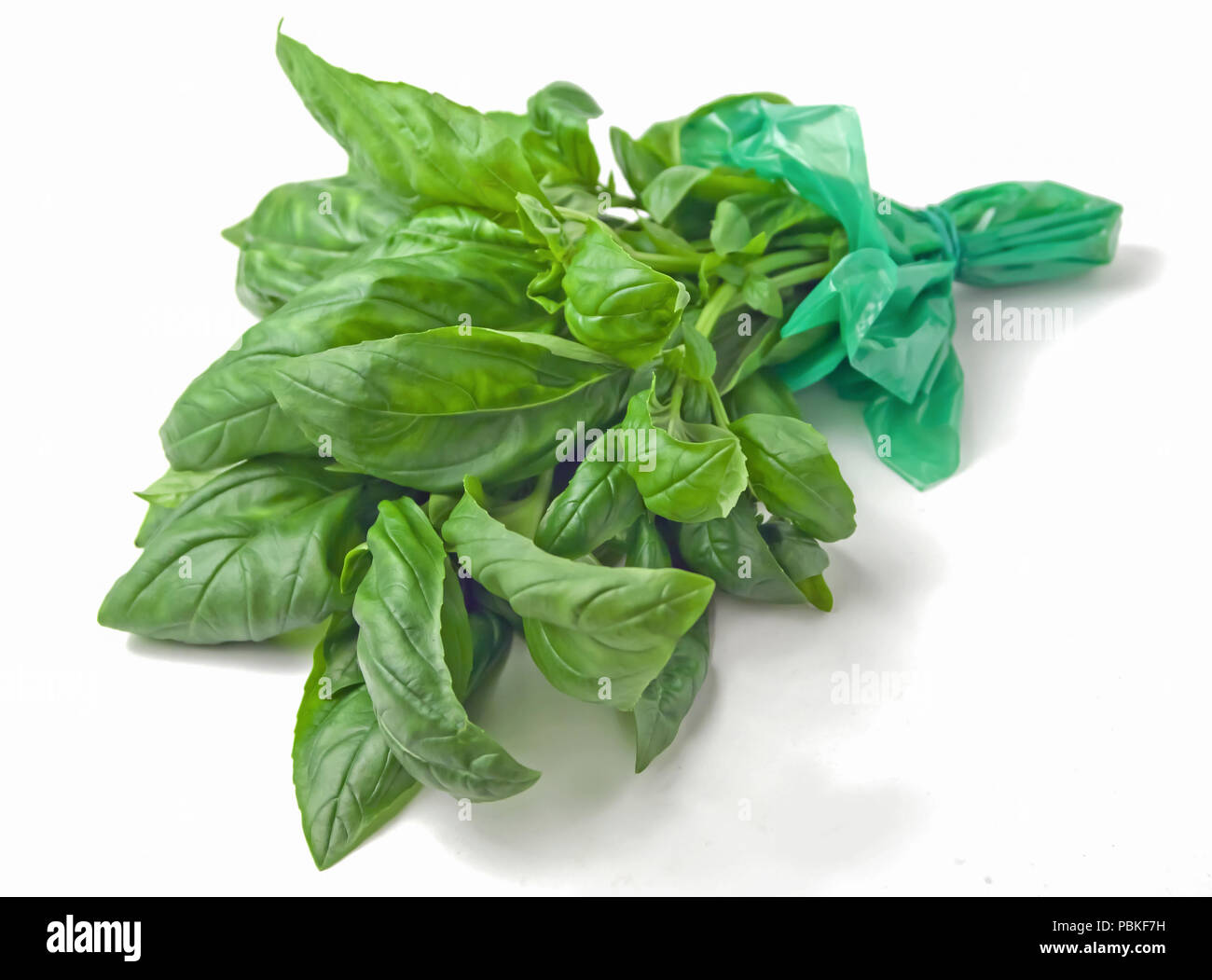 Bunch of fresh basil isolated on white Stock Photo - Alamy