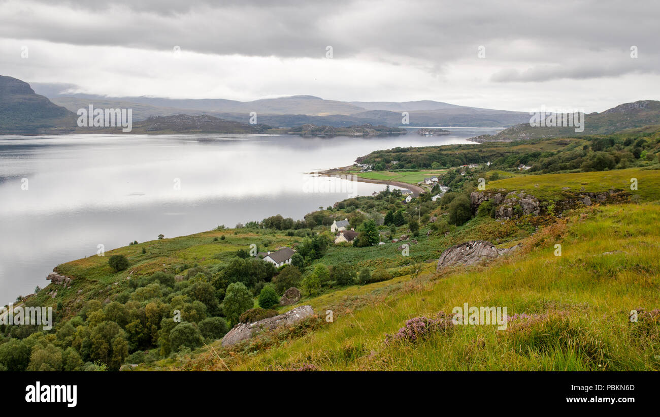 A fishing boat passes between rocky islands and peninsulas in Loch ...