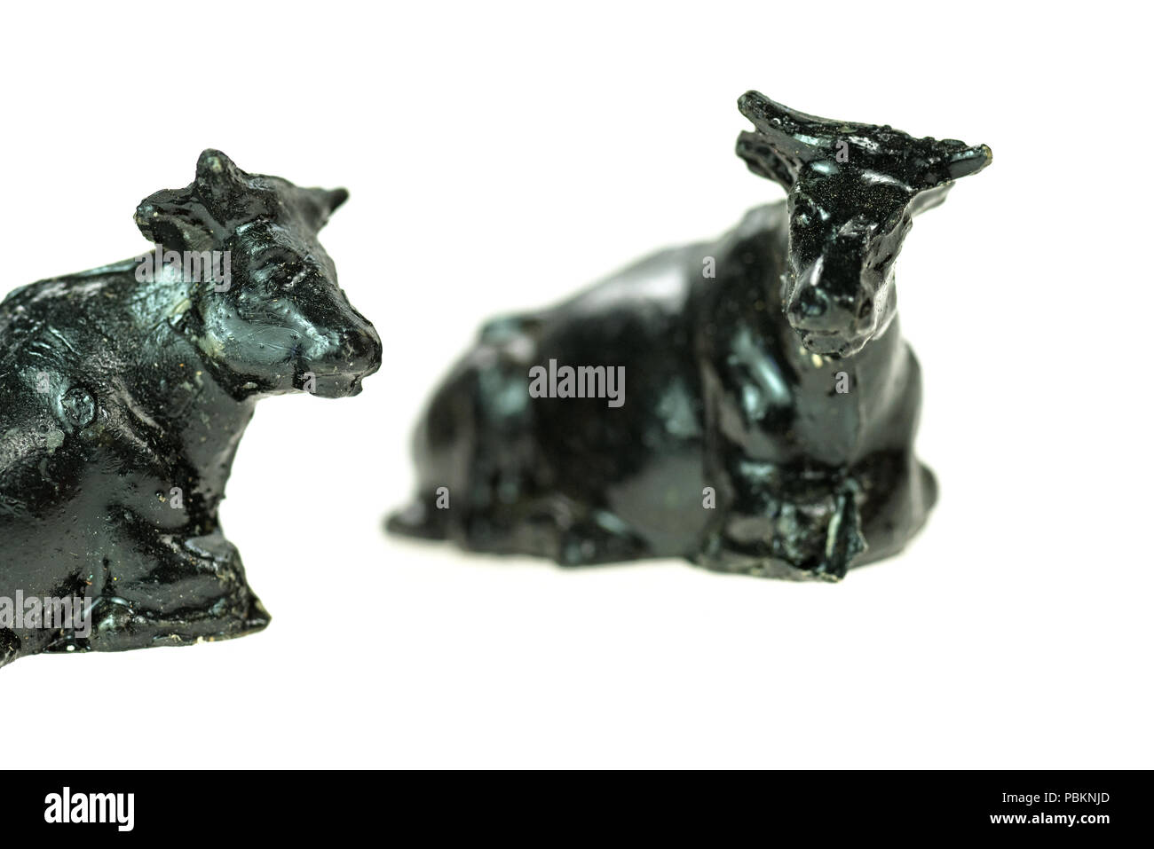 Toy cows from a vintage Noah's Ark play set, photographed on a white ...