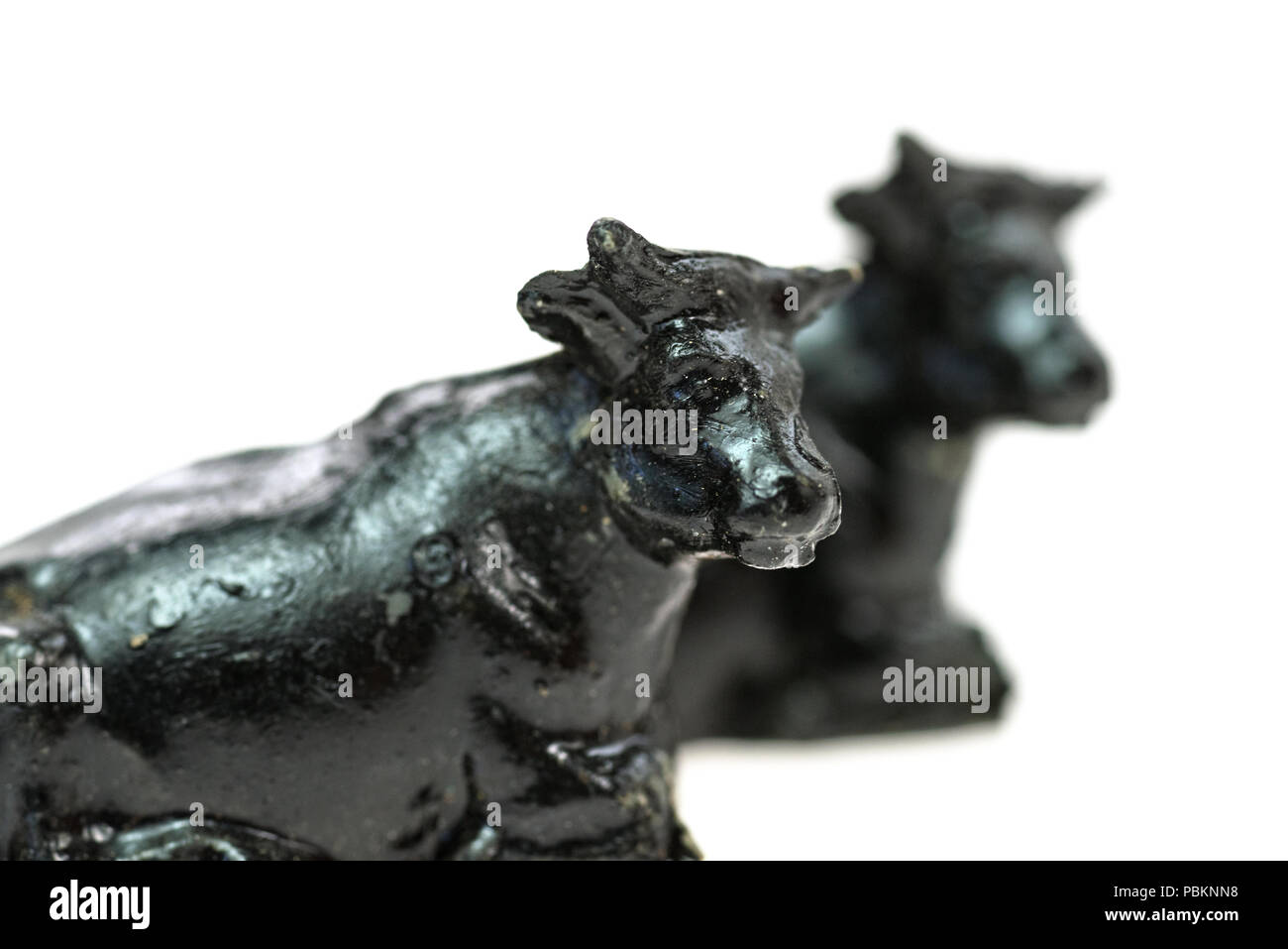 Toy cows from a vintage Noah's Ark play set, photographed on a white ...