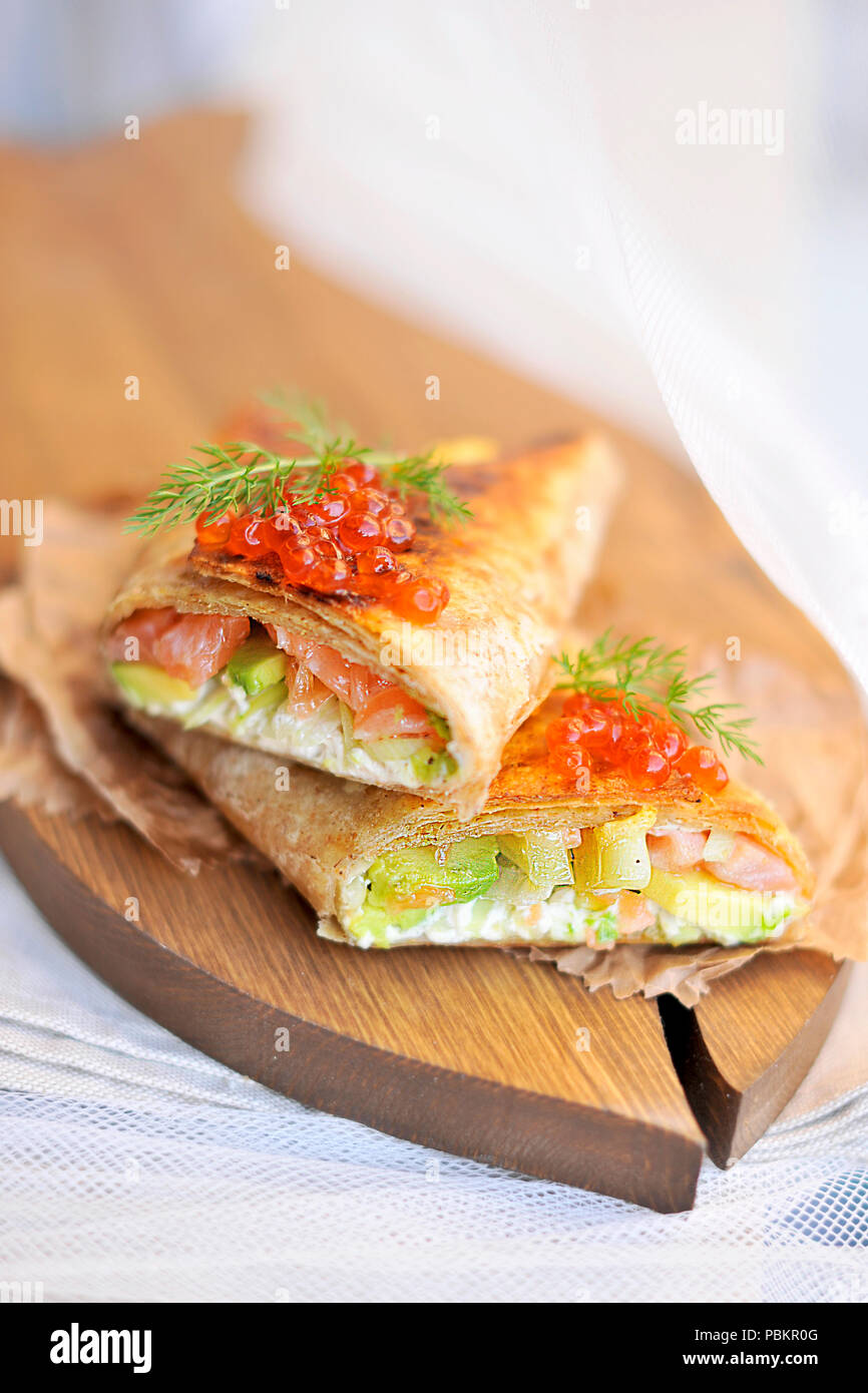 roll of bread with fish and caviar, delicious seafood. Asian cuisine ...