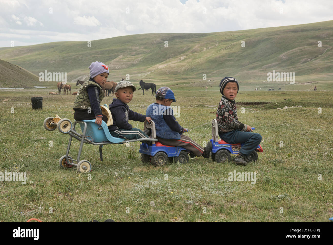 Nomadic boys playing on the plains, Sary Mogul, Kyrgyzstan Stock Photo ...