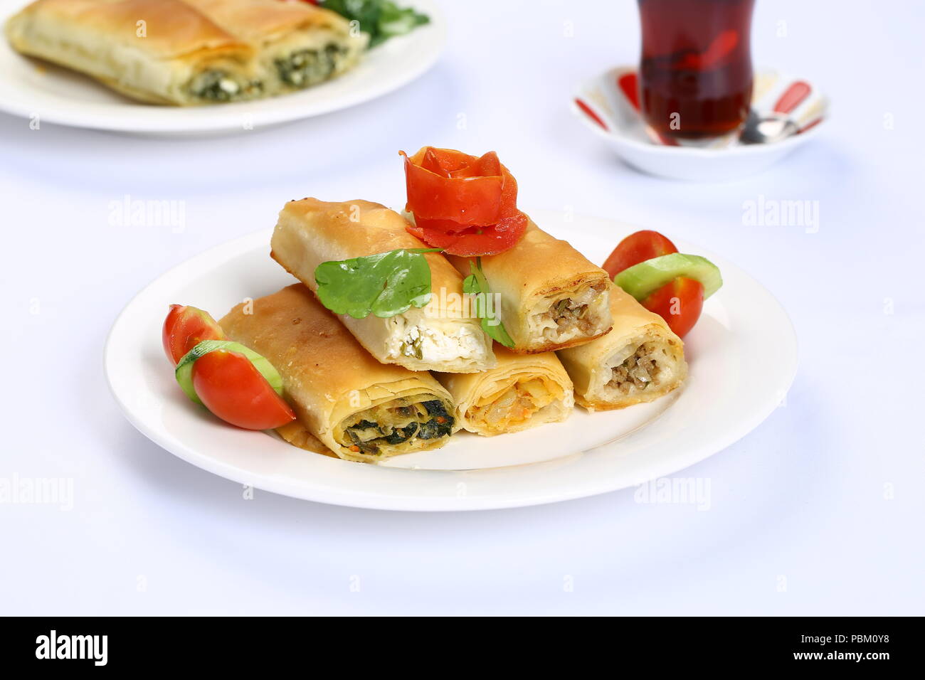 Freshly baked Turkish borek pastry rolls Stock Photo - Alamy