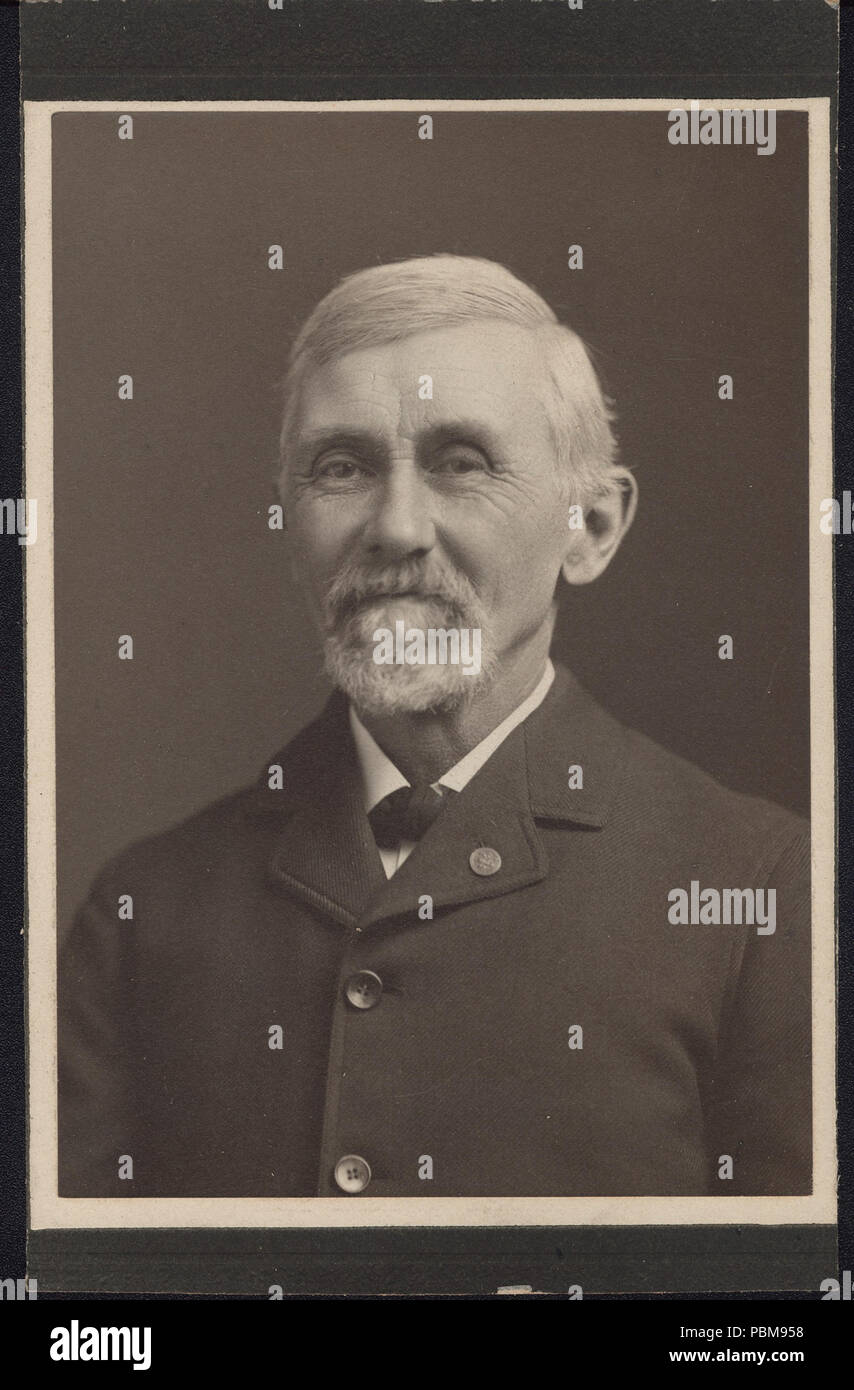 . English: Formal bust portrait of J. D. Edwards wearing a suit, and ...