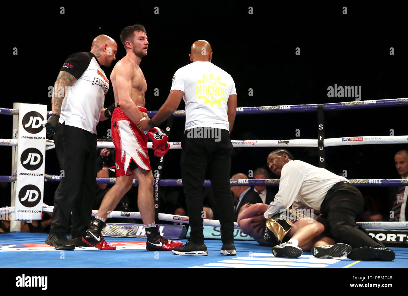 Anthony Fowler (second left) checks on Craig O'Brien after their Super ...