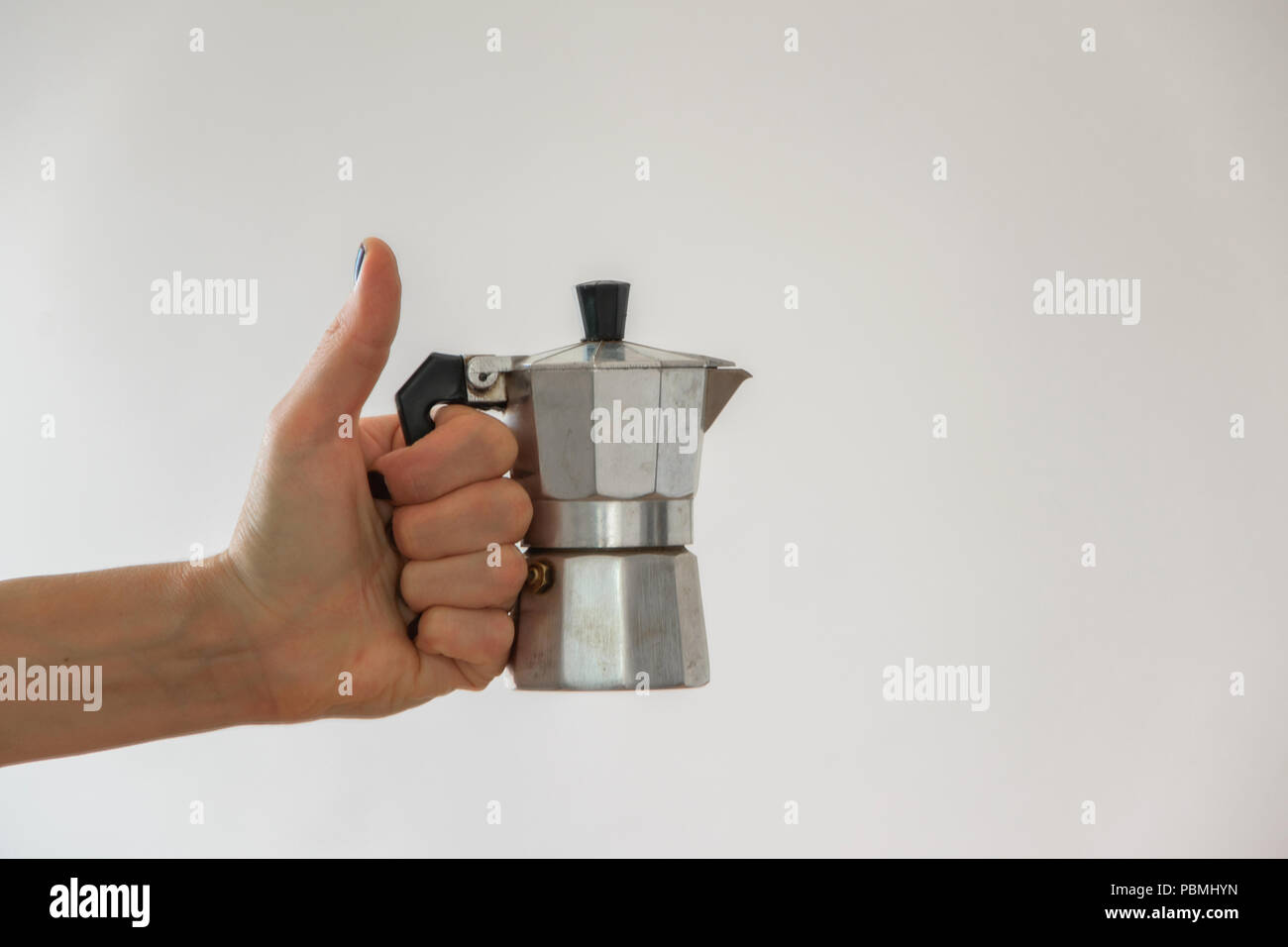 Isolated woman hand holding a moka - traditional italian coffee maker ...