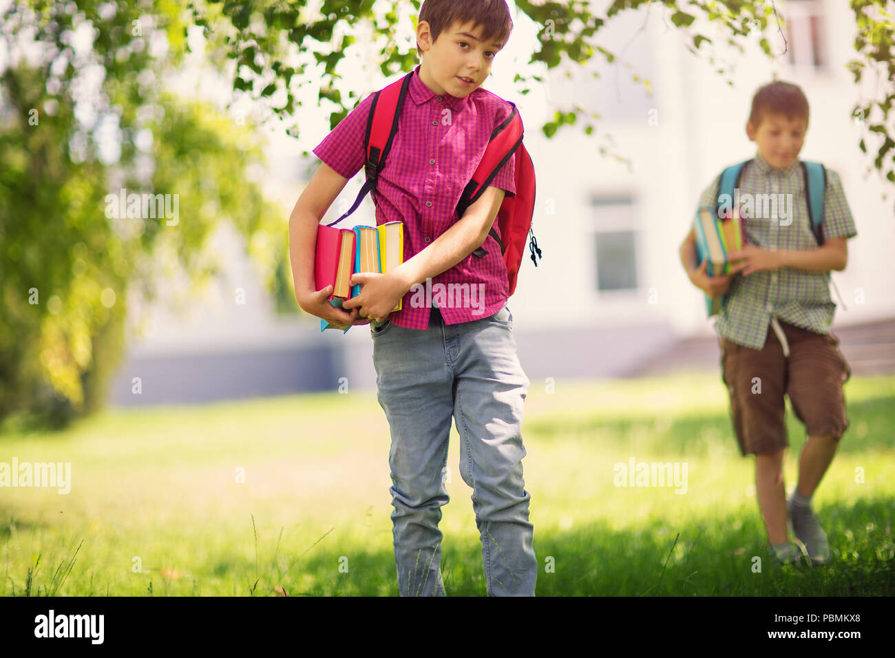 Children outside school building backpack hi-res stock photography and ...