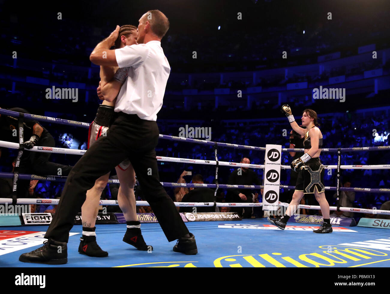 Katie Taylor (right) celebrates beating Kimberly Connor during their ...