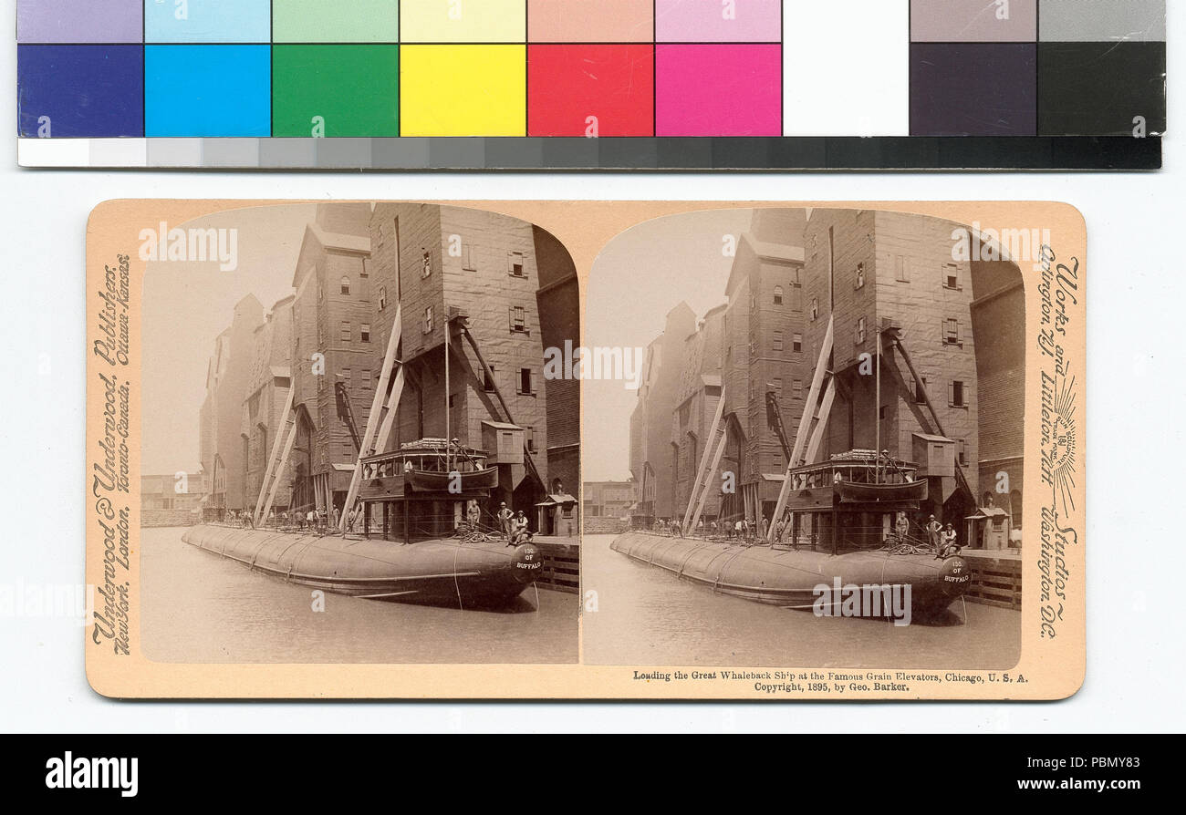 930 Loading the great whaleback ship at the famous grain elevators ...