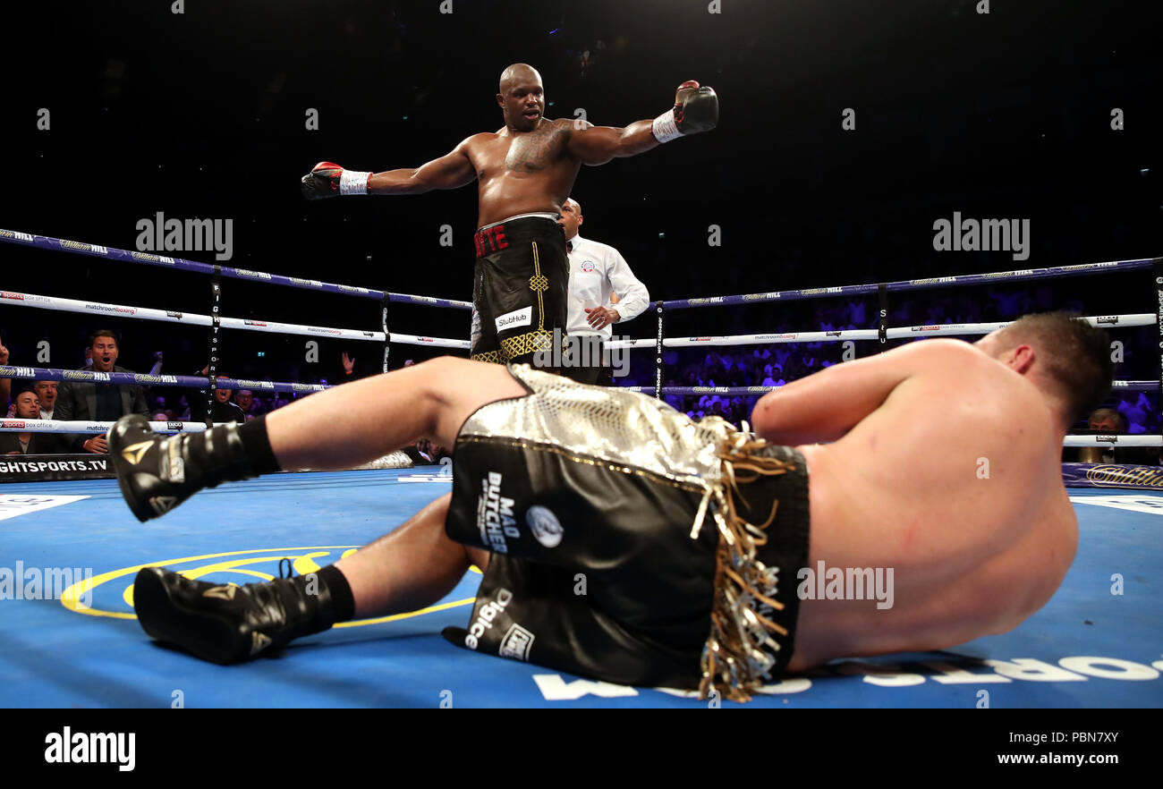 Dillian Whyte (back) knocks down Joseph Parker during their prior to ...