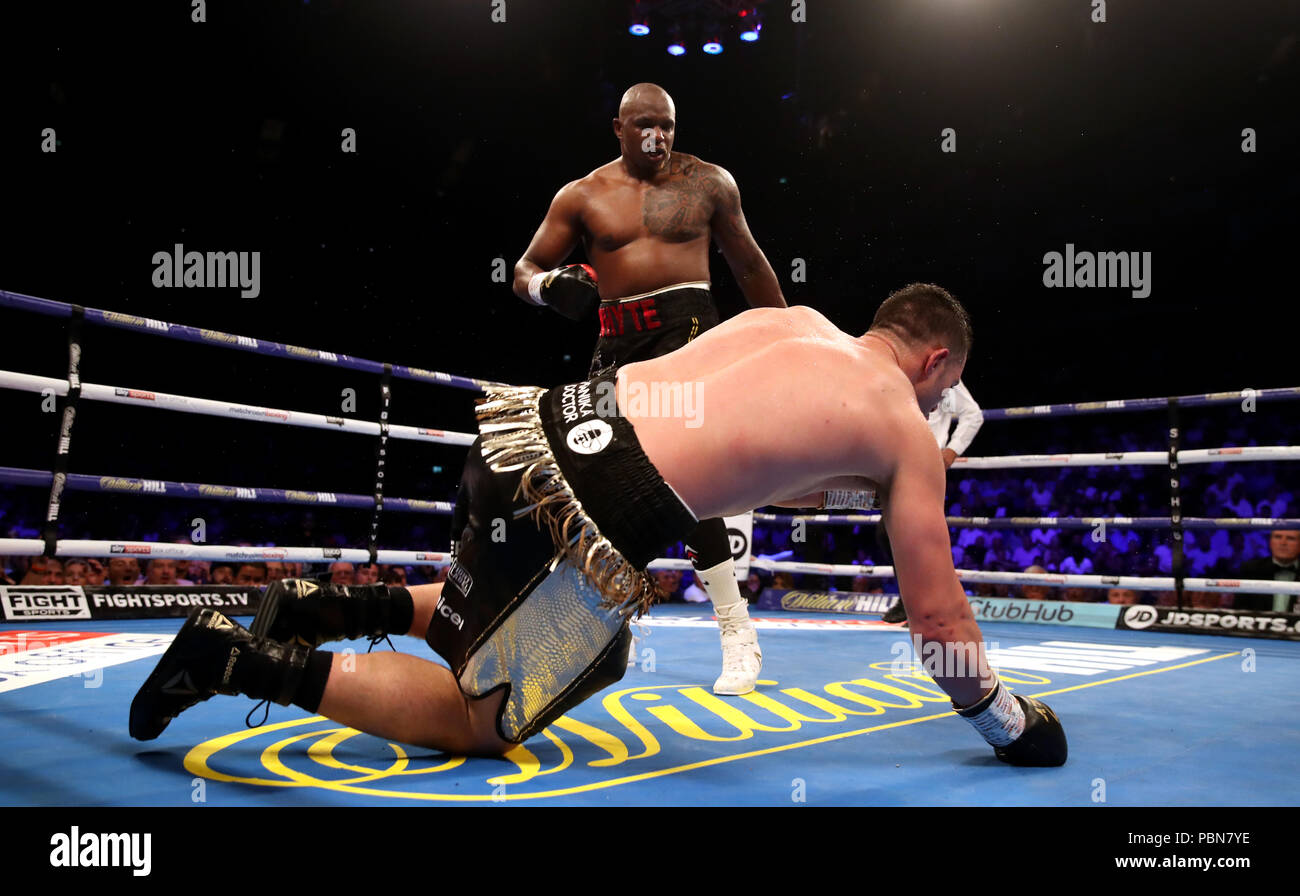 Dillian Whyte (back) knocks down Joseph Parker during their prior to ...