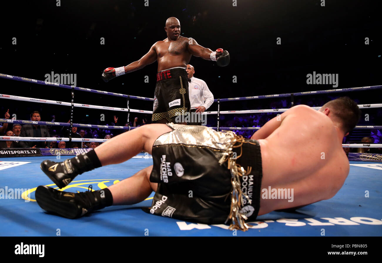 Dillian Whyte (back) knocks down Joseph Parker during their prior to ...