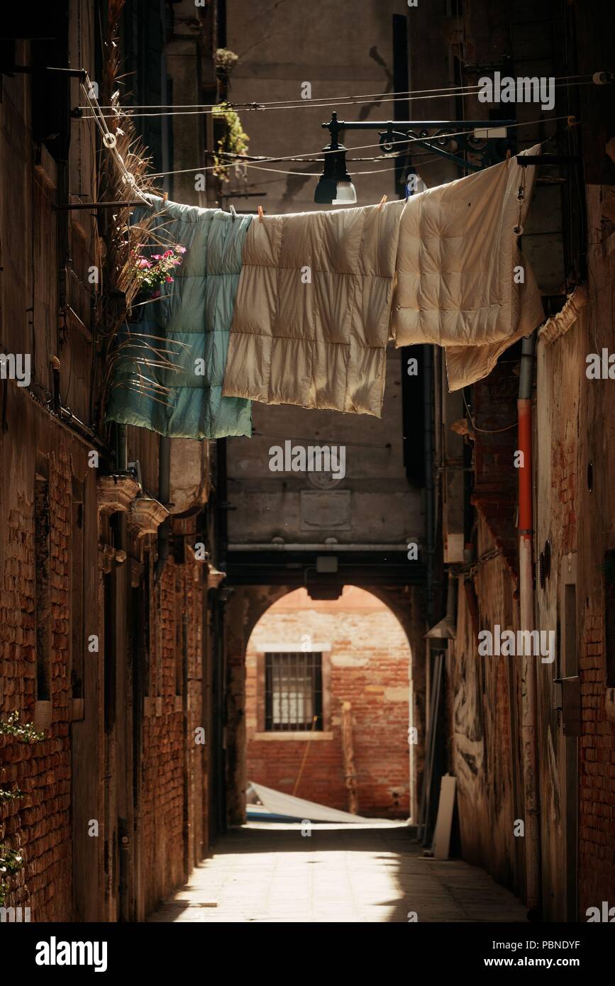 Alley view with arch and historical buildings in Venice, Italy Stock ...