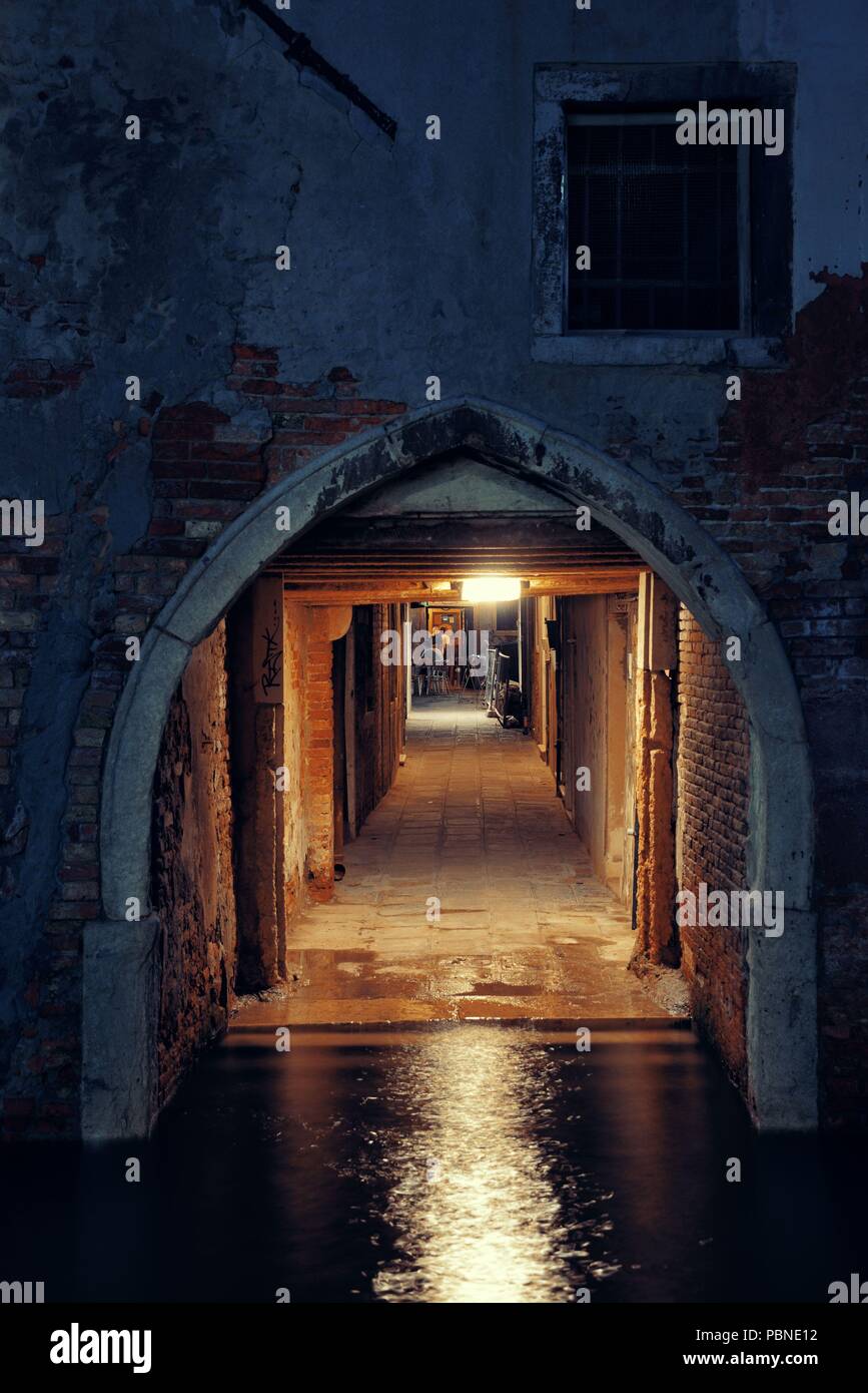 A walkway leading to street at night in Venice. Italy Stock Photo - Alamy