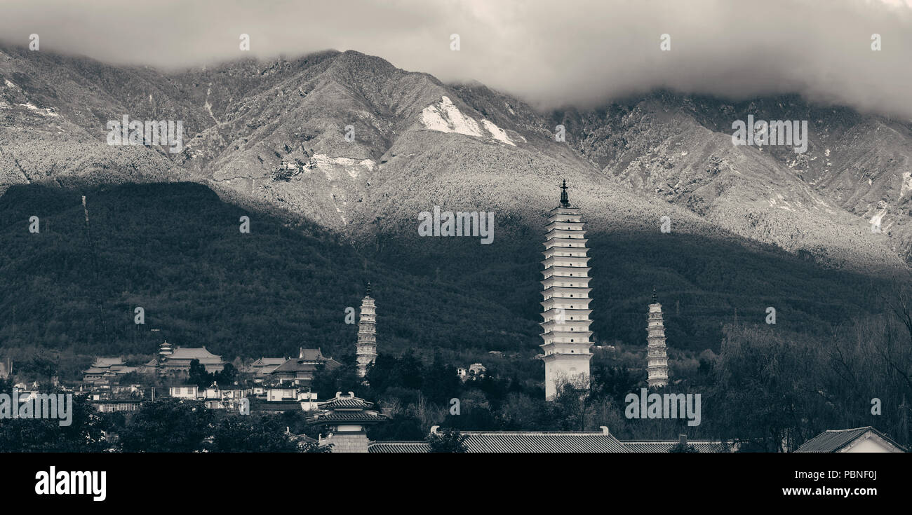 Ancient pagoda in Dali old town with snow capped Mt Cangshan, Yunnan ...