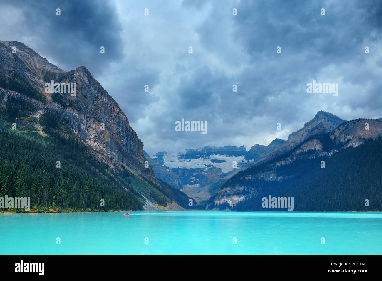 Lake Louise in Banff national park with mountains and forest in Canada ...