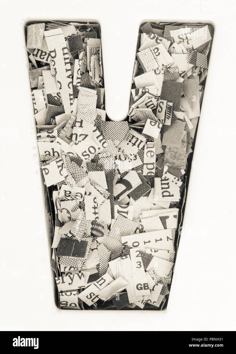 Capital letter made from cut up old newspaper Macro photography Stock ...