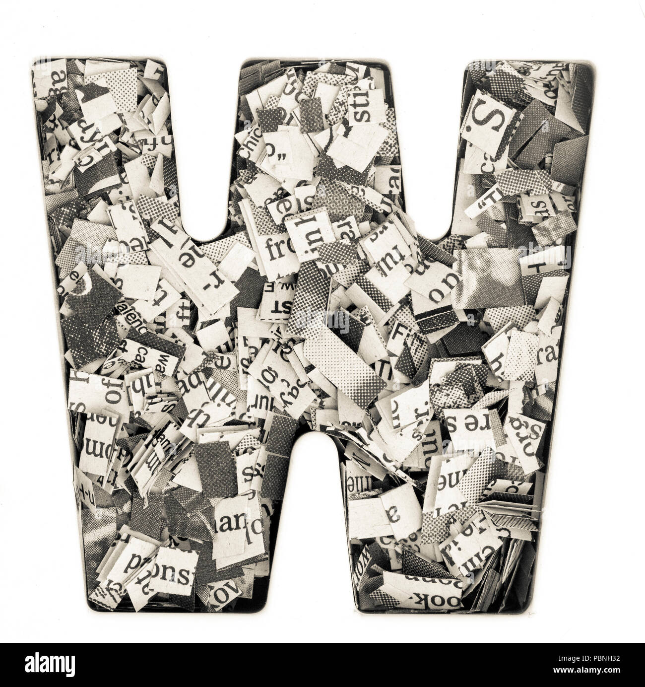 Capital letter made from cut up old newspaper Macro photography Stock ...