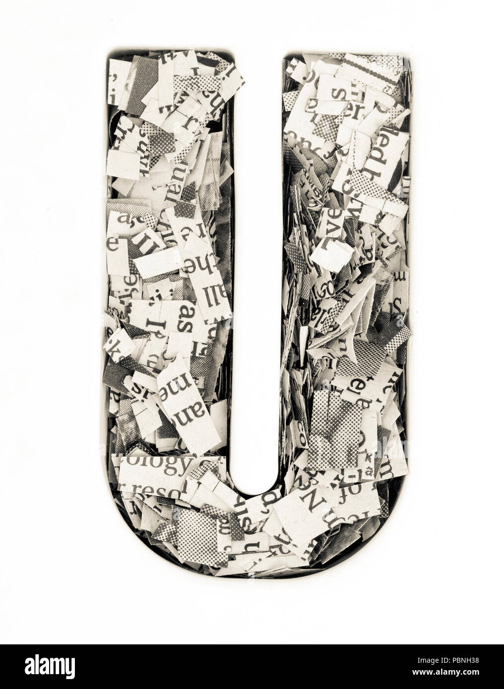 Capital letter made from cut up old newspaper Macro photography Stock ...