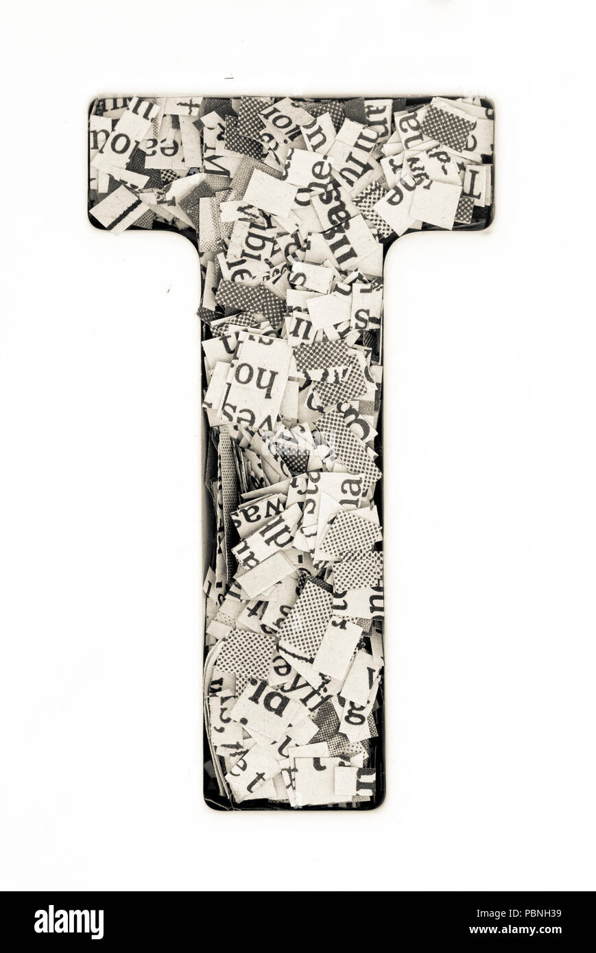 Capital letter made from cut up old newspaper Macro photography Stock ...
