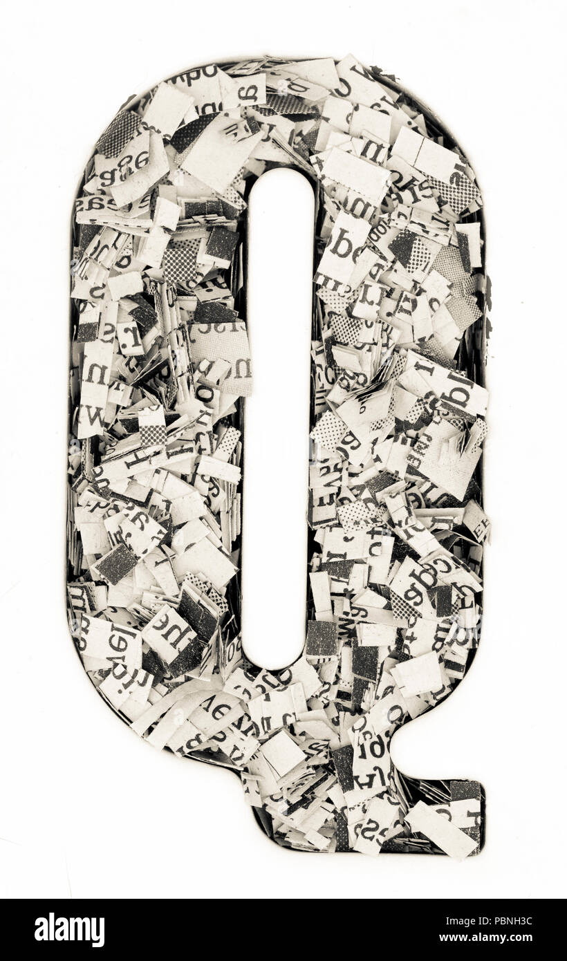Capital letter made from cut up old newspaper Macro photography Stock ...