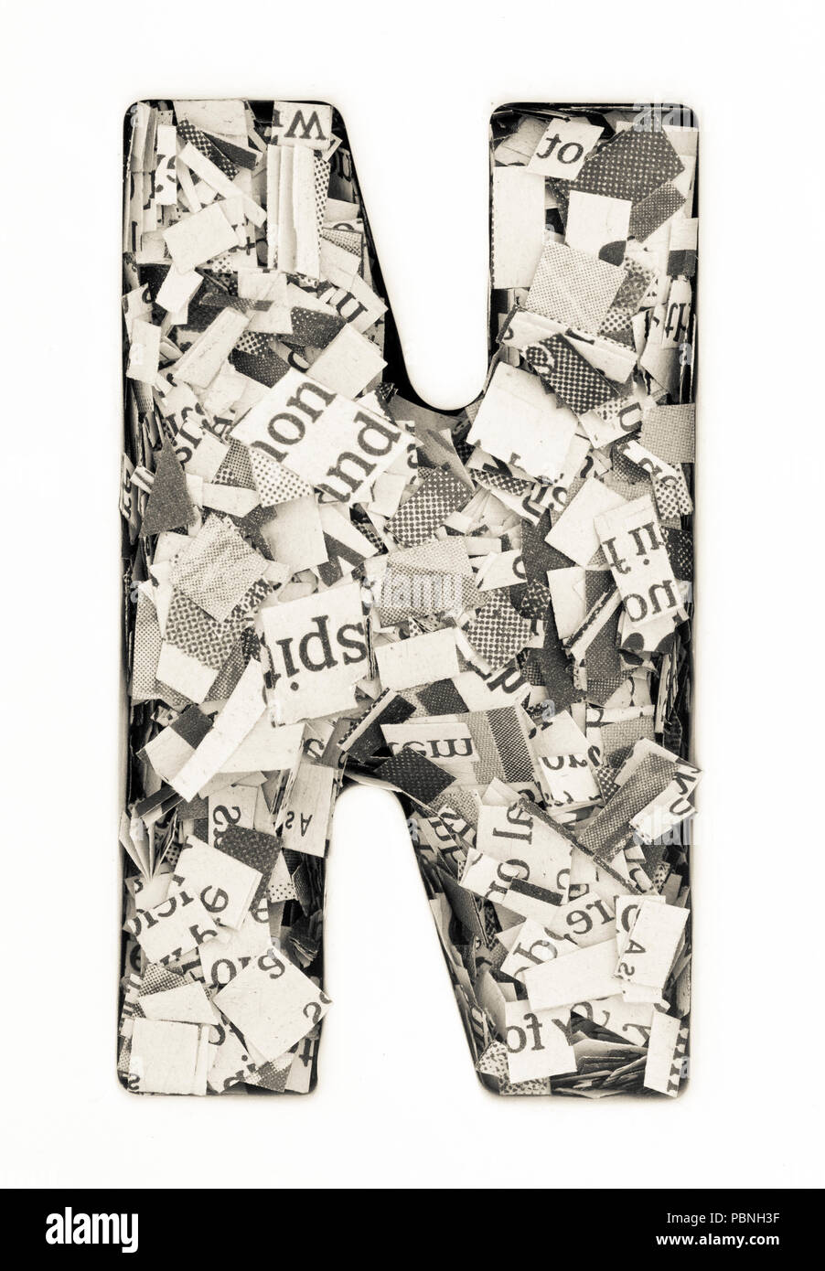 Capital letter made from cut up old newspaper Macro photography Stock ...