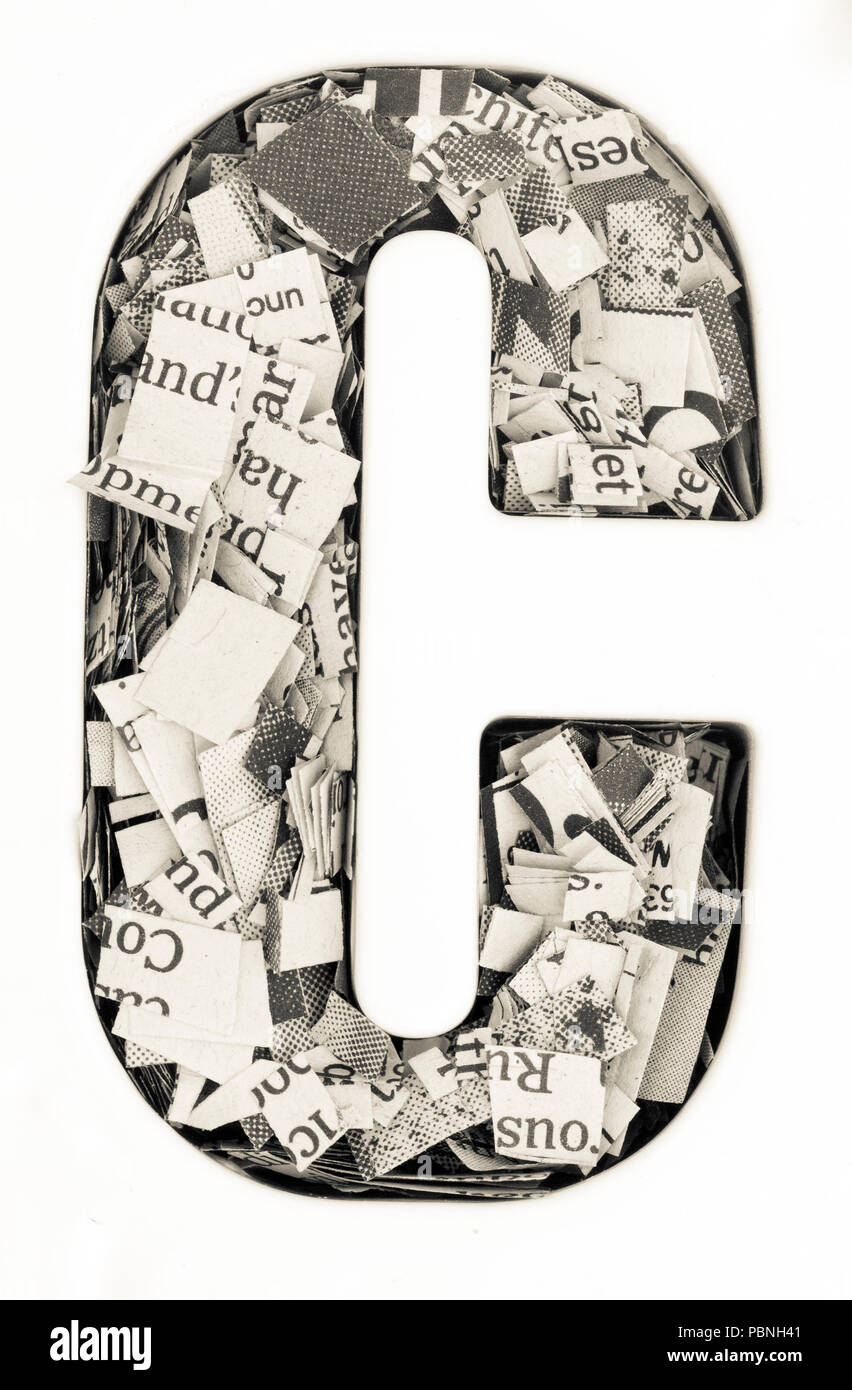 Capital letter made from cut up old newspaper Macro photography Stock ...