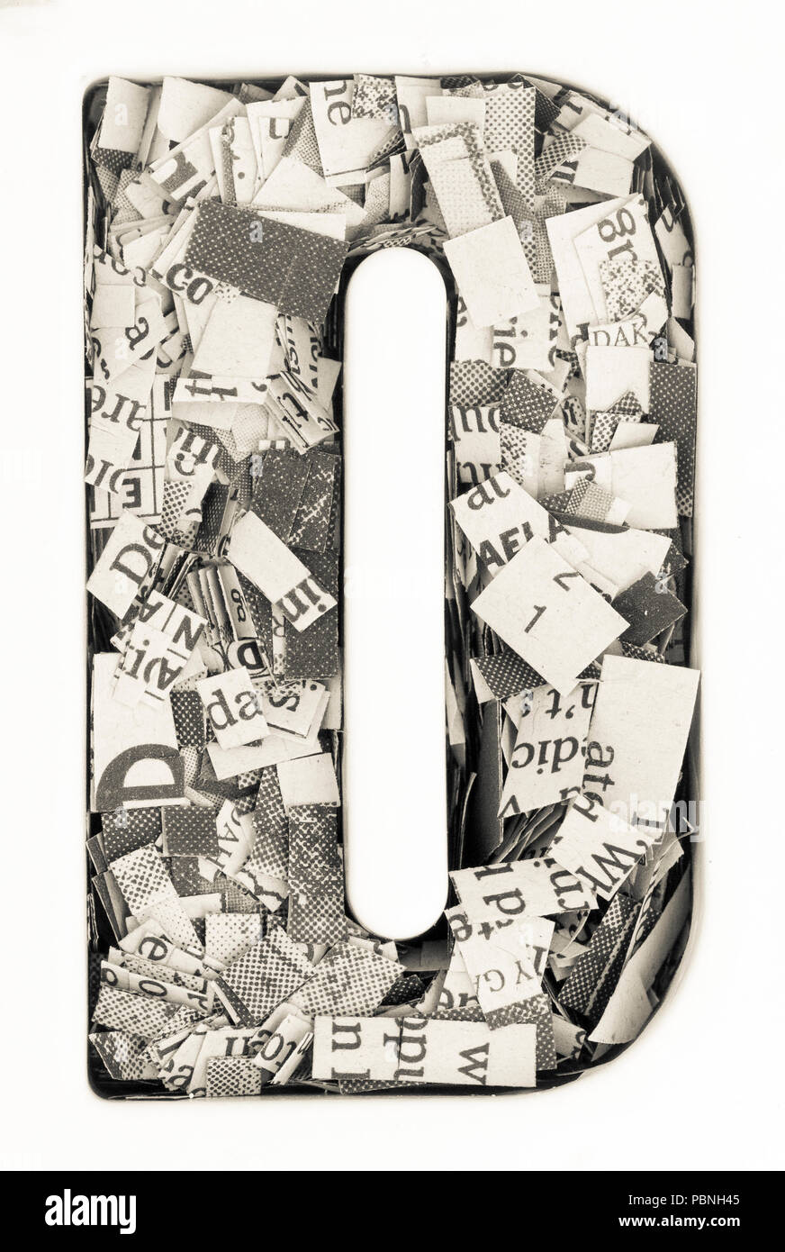 Capital letter made from cut up old newspaper Macro photography Stock ...