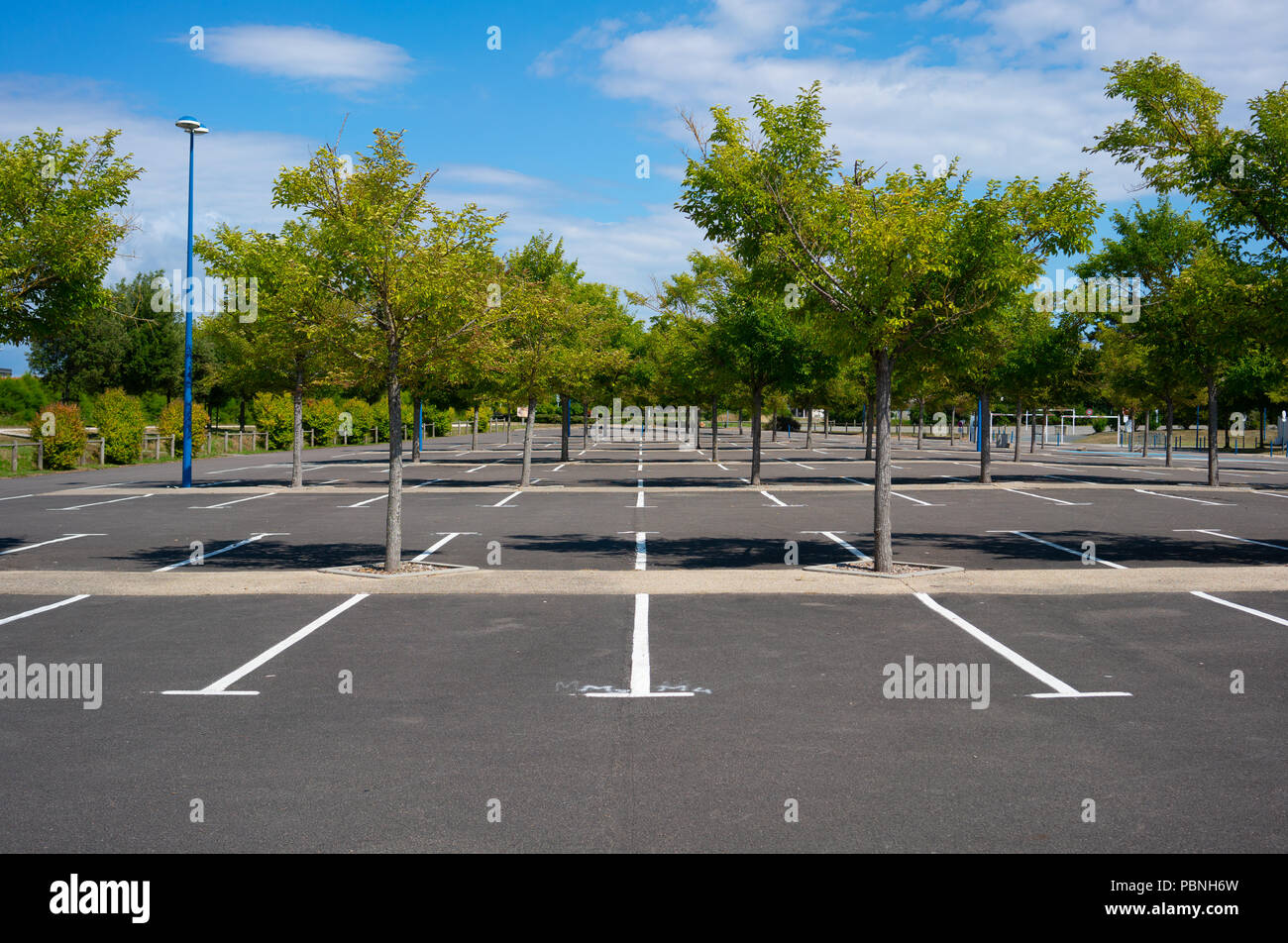 Beautiful empty Parking lot with trees on sunny summer day in France ...