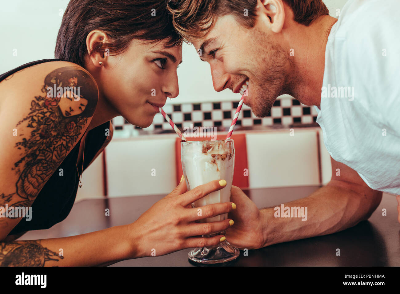 Sharing a glass hi-res stock photography and images - Alamy