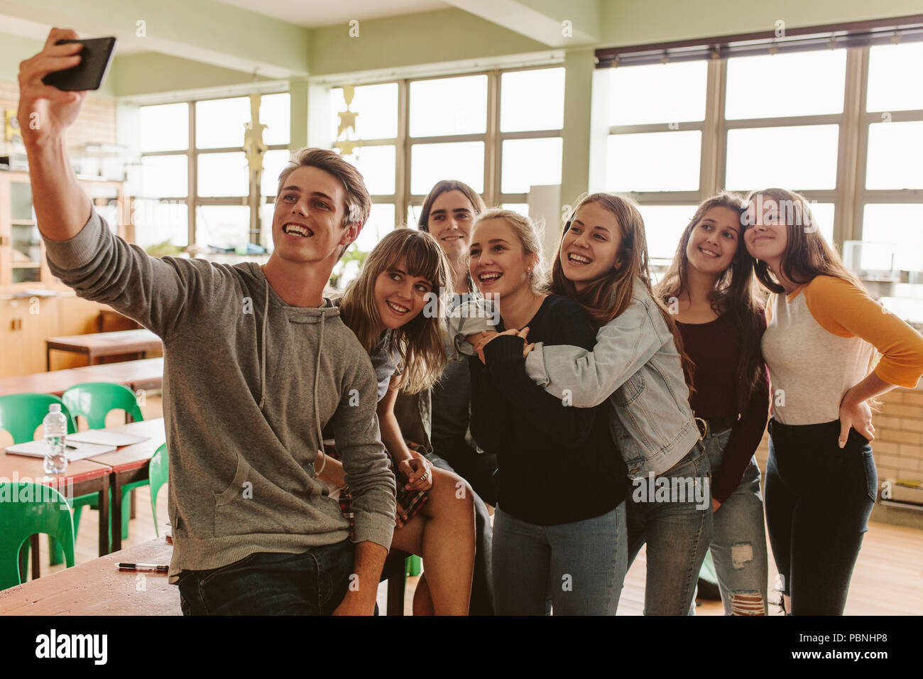 Group of university students making a selfie with smart phone in ...