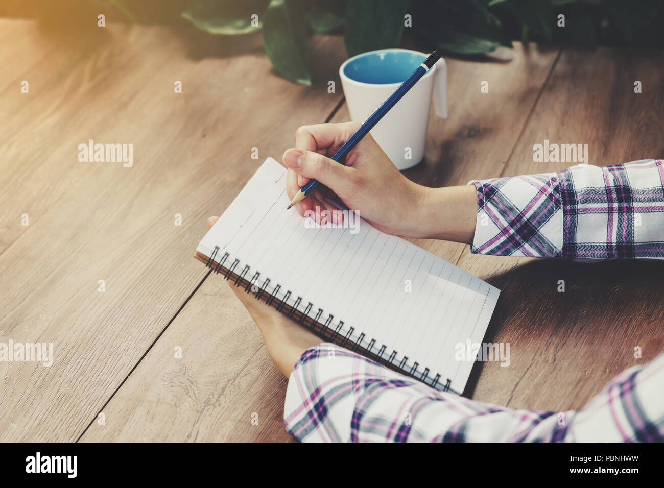 Beautiful teen girl writing in notebook hi-res stock photography and ...