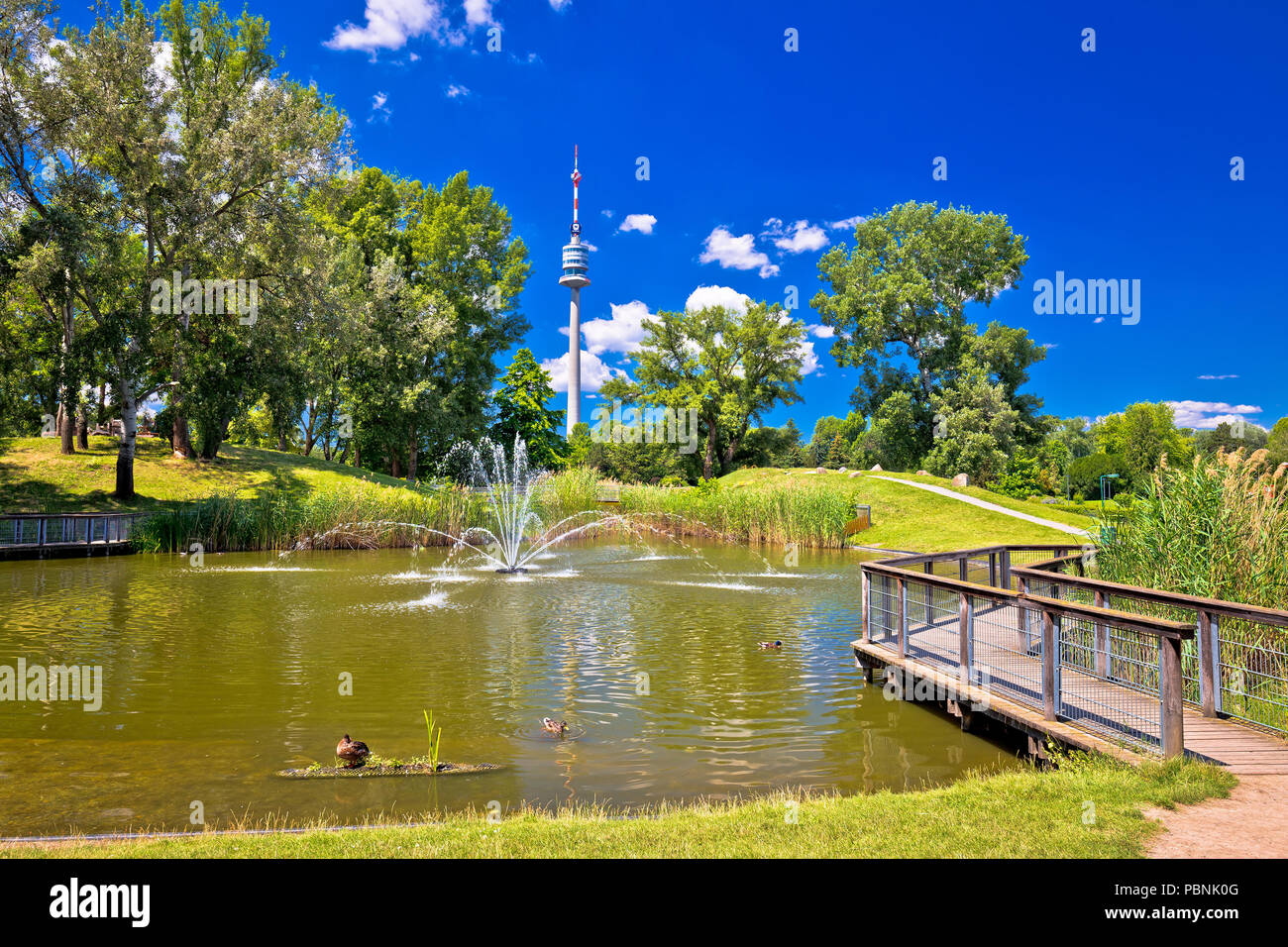 Donaupark lake fountain and Donauturm tower view in Vienna, capital of ...