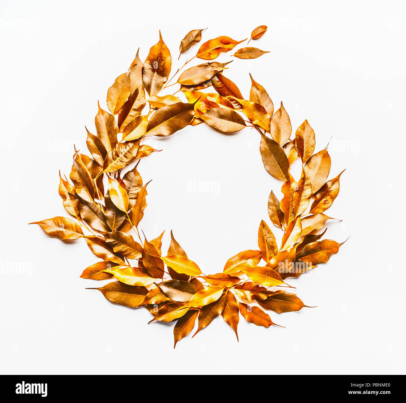 Gold autumn leaves wreath on white background, top view. Fall leaves ...
