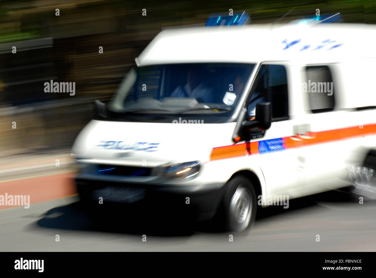 Speeding police van blur in London Stock Photo - Alamy