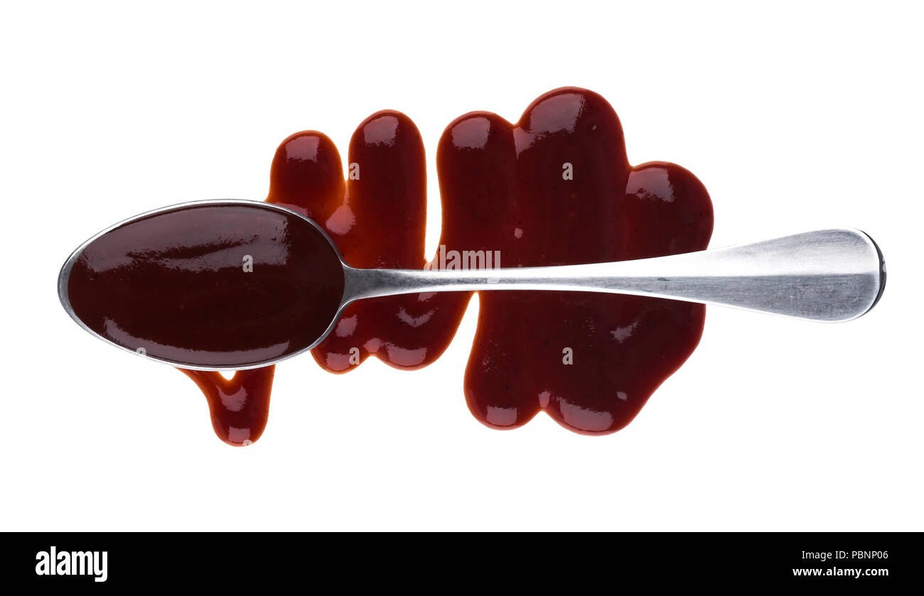 Barbecue sauce. Splashes and spilled grill sauce with spoon isolated on ...