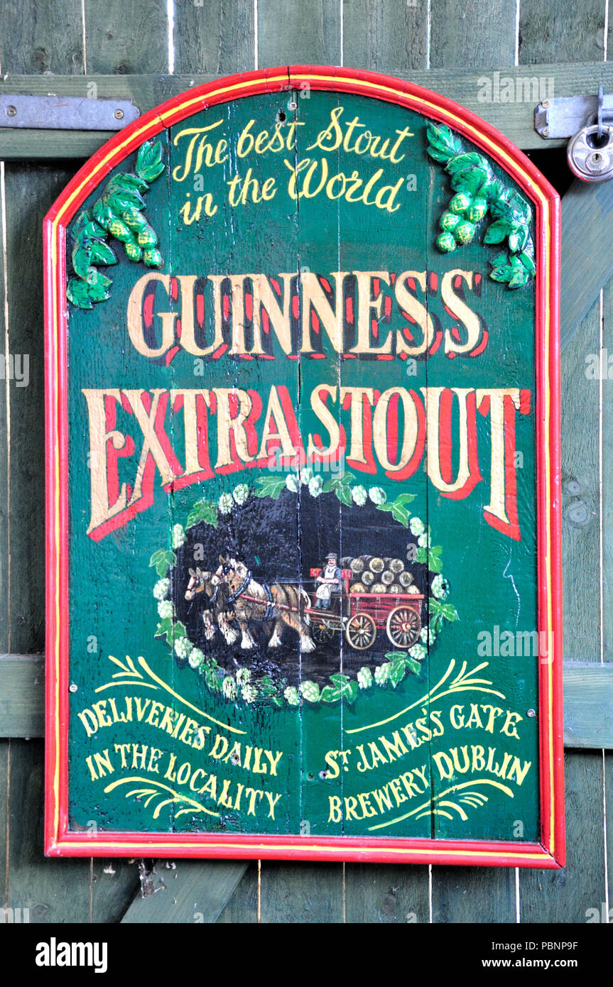 Guinness advertising sign Stock Photo - Alamy