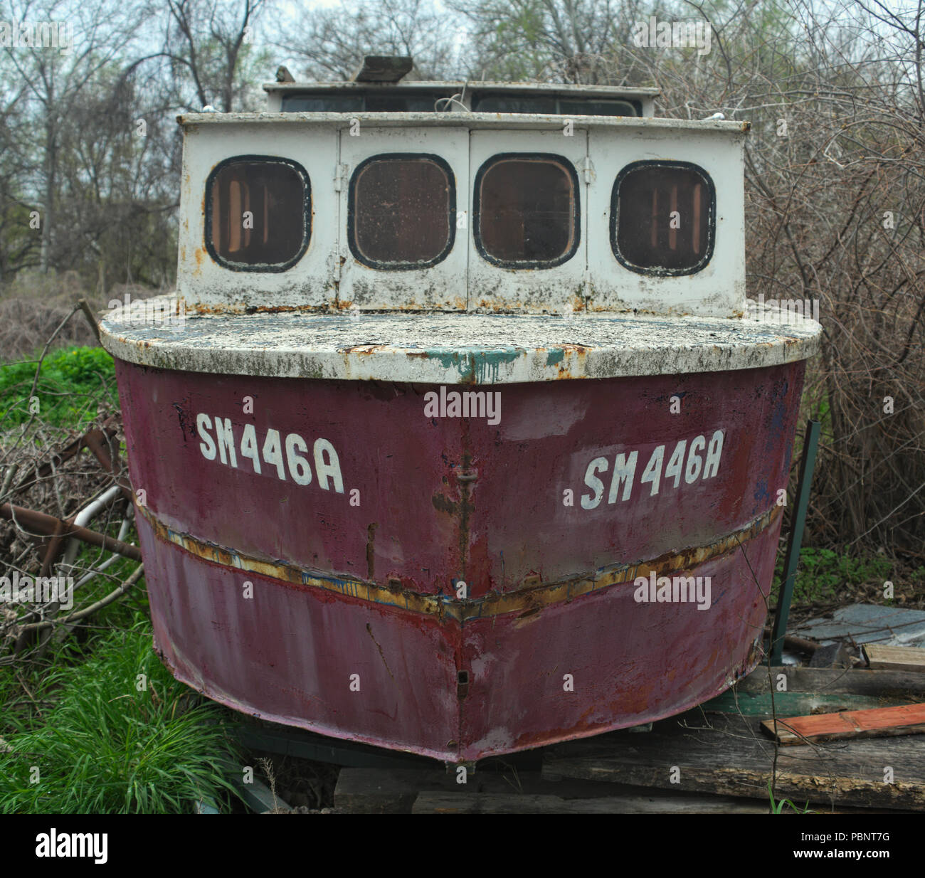 Old abandoned wrecked boat at river shore Stock Photo - Alamy