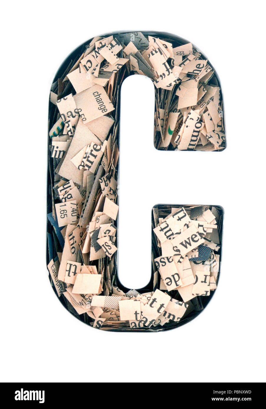 financial news newspaper cut up into confetti to make the captal letter ...