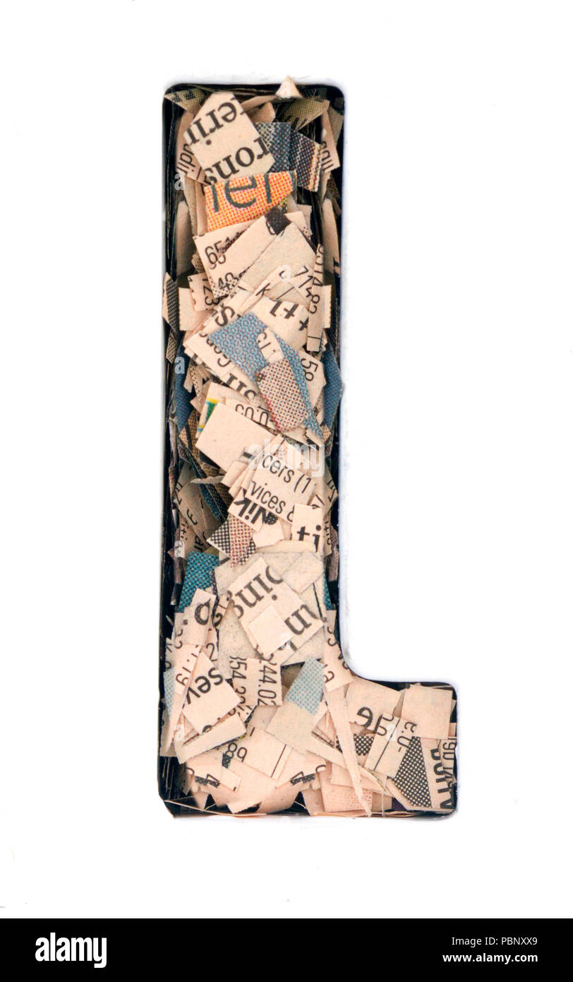 financial news newspaper cut up into confetti to make the captal letter ...