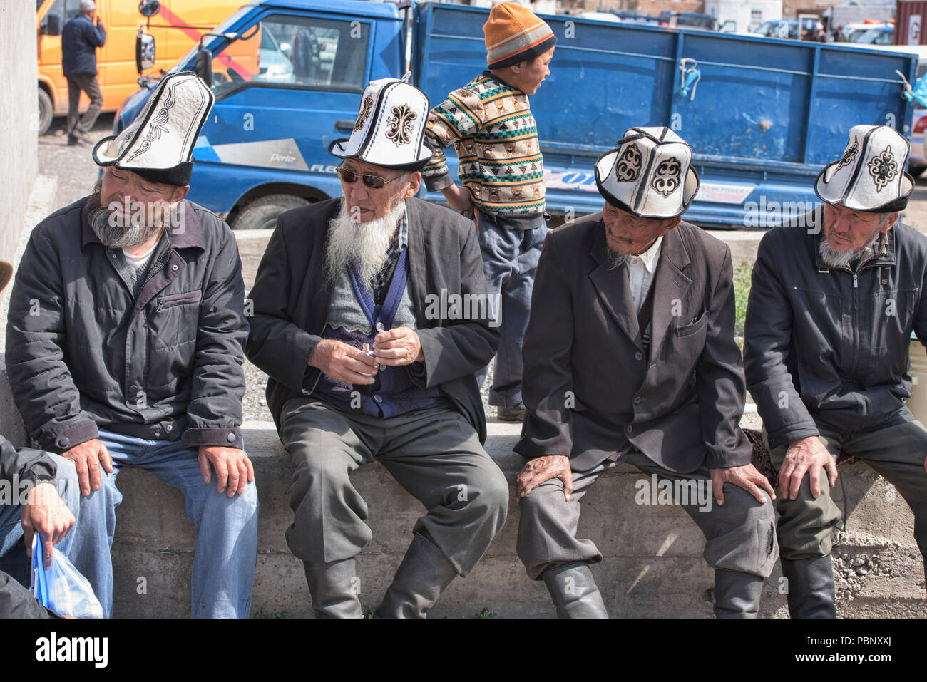 Men sporting kalpak hats in the bazaar, Sary Mogul, Kyrgyzstan Stock ...