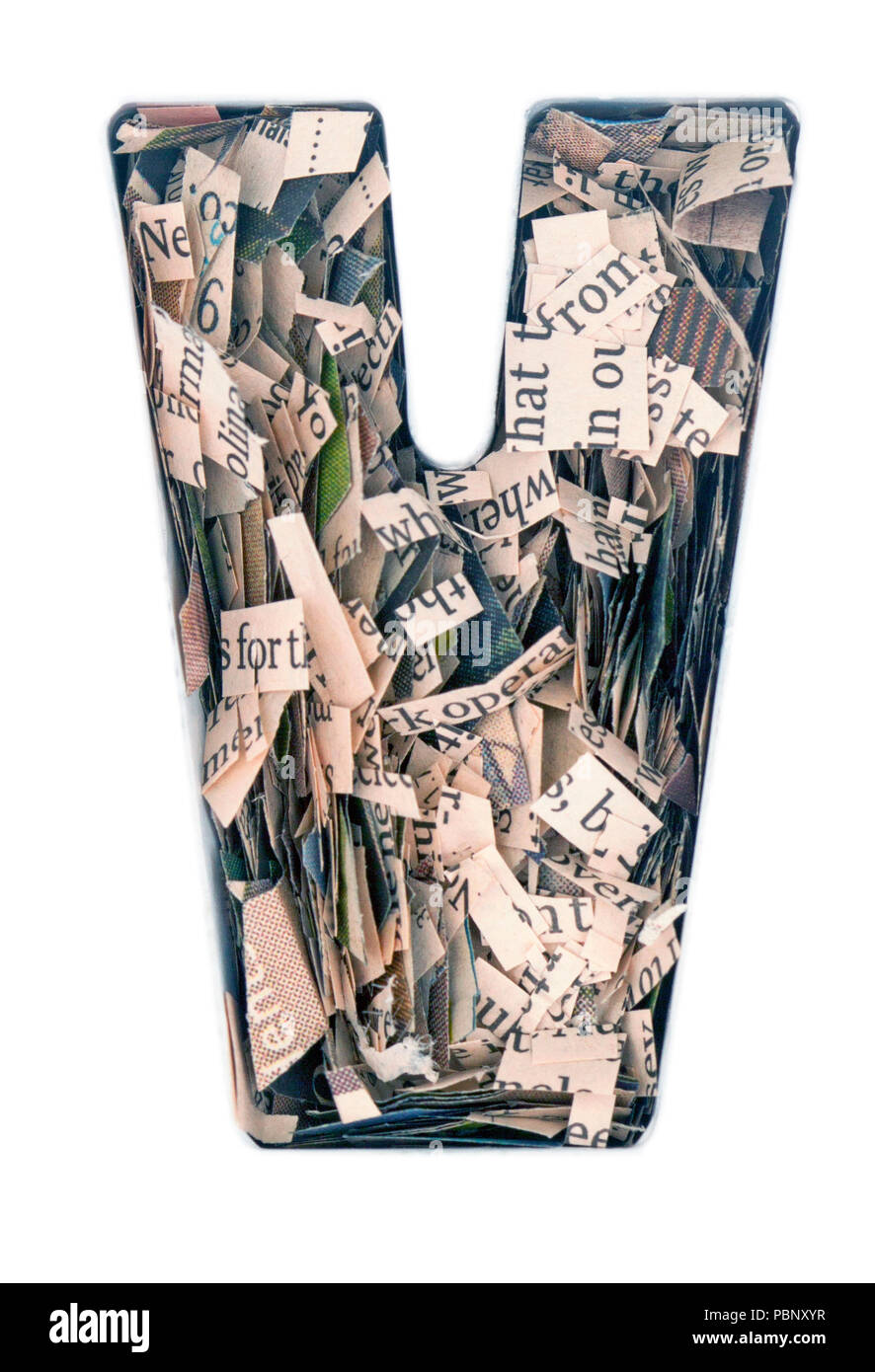 financial news newspaper cut up into confetti to make the captal letter ...
